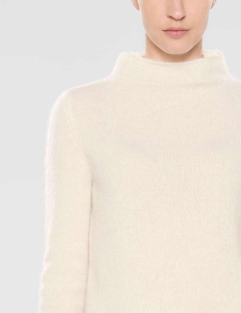 White fitted sweater with mock neck by Sarah Pacini