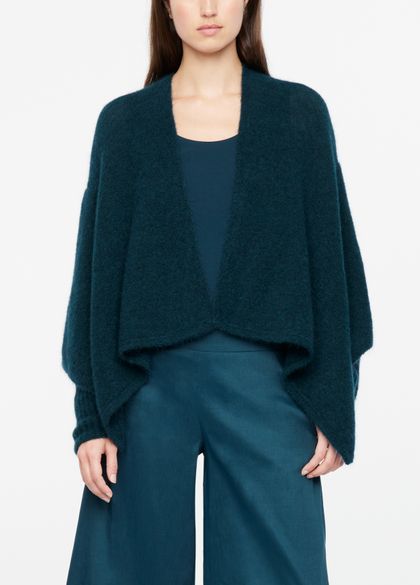 Buy your women's ponchos online at Sarah Pacini